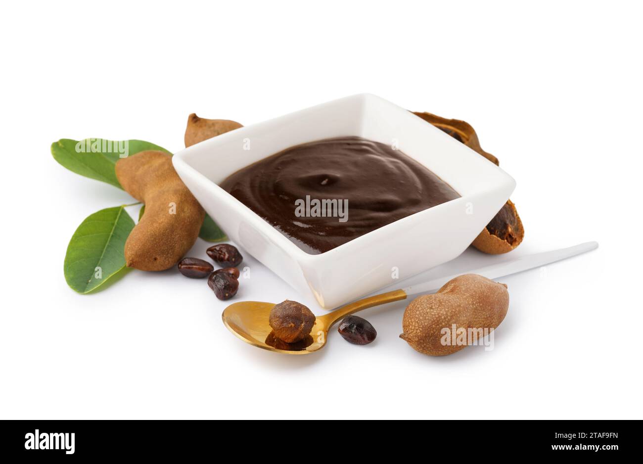 Bowl with tasty tamarind jam and fruits on white background Stock Photo ...