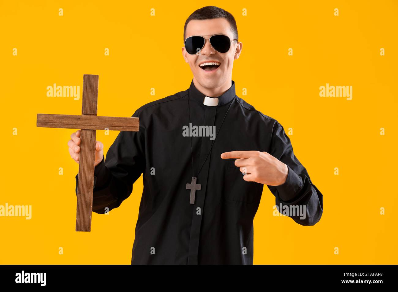 Portrait black young priest pointing hi-res stock photography and ...