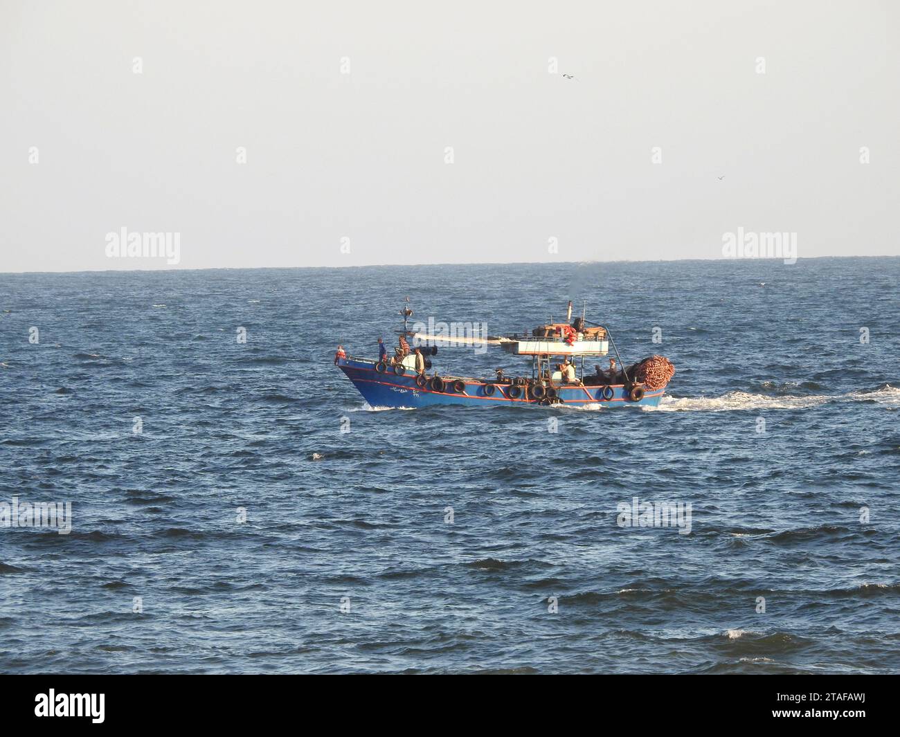 Alexandria, Egypt, September 10 2022: A fishing vessel with fishermen ...