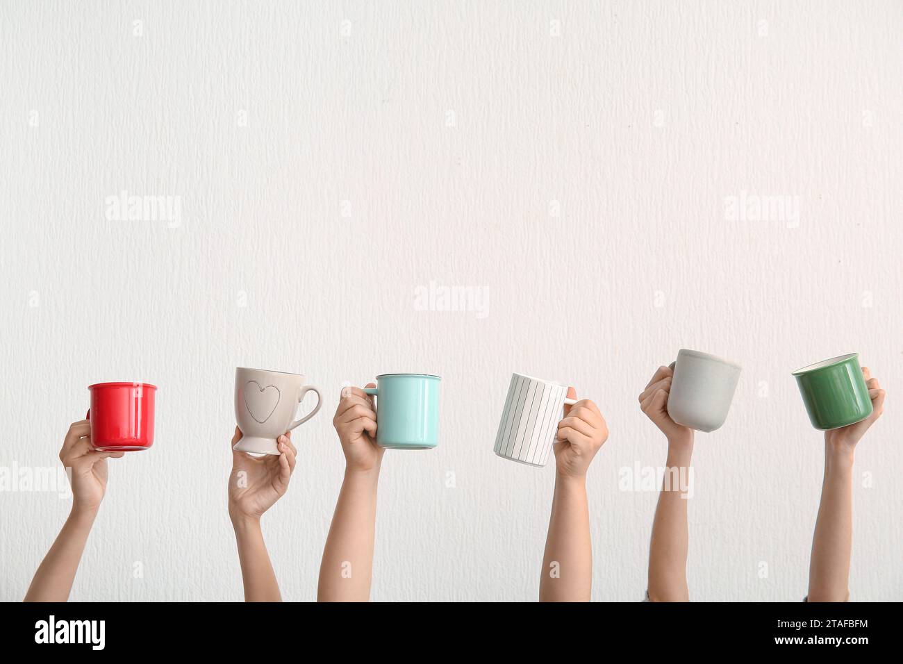 Female hands different cups hi-res stock photography and images - Alamy