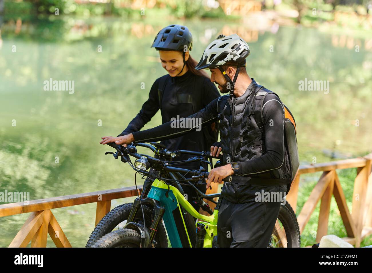 A blissful couple, adorned in professional cycling gear, enjoys a ...