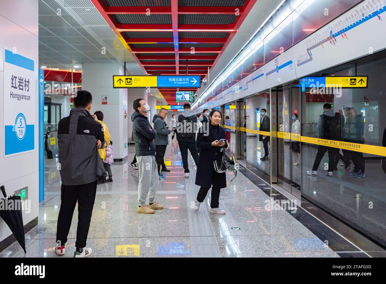 CHONGQING, CHINA - NOVEMBER 30, 2023 - Citizens ride the newly opened ...
