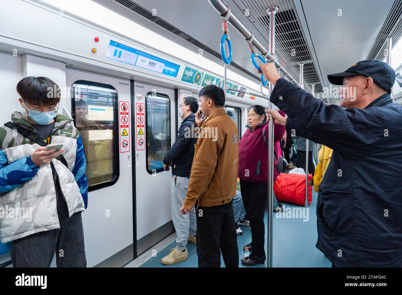 CHONGQING, CHINA - NOVEMBER 30, 2023 - Citizens ride the newly opened ...
