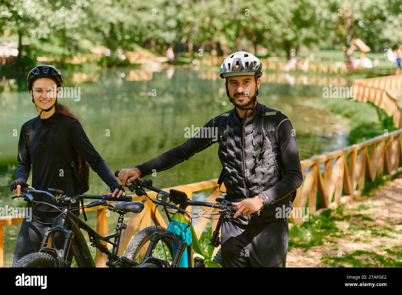 A blissful couple, adorned in professional cycling gear, enjoys a ...