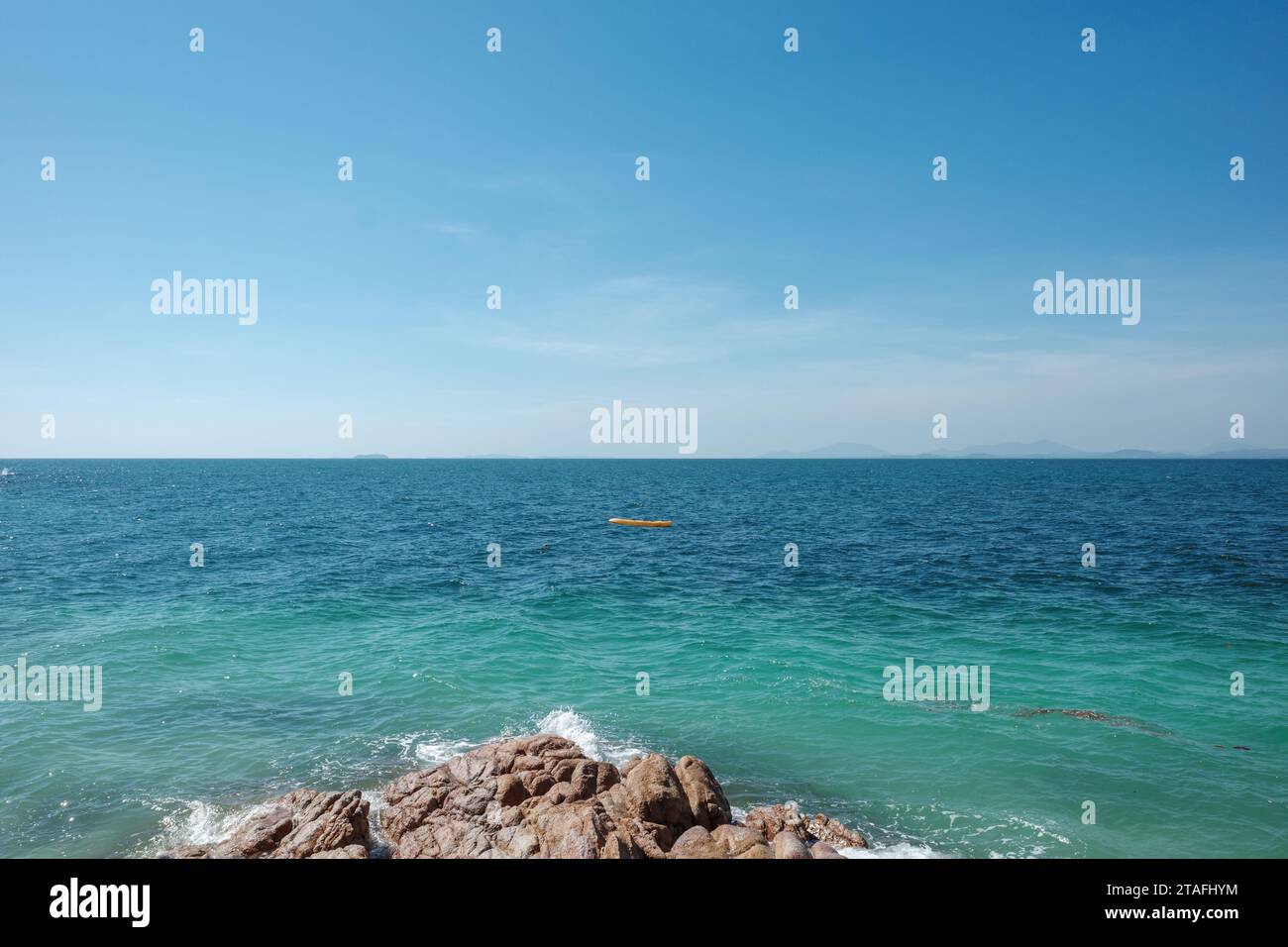 Outdoor scenery view of small boat anchoring and sea waves with clear ...