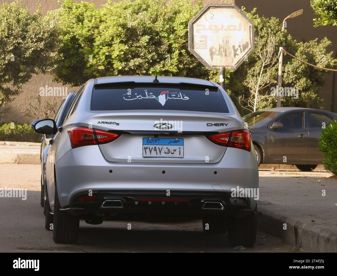 Cairo, Egypt, November 14 2023: Arabic word of Palestine on the back windshield of Chery car ...