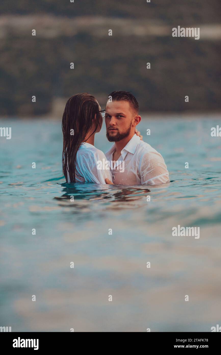 A symbolic and emotionally connected couple tenderly embraces against ...