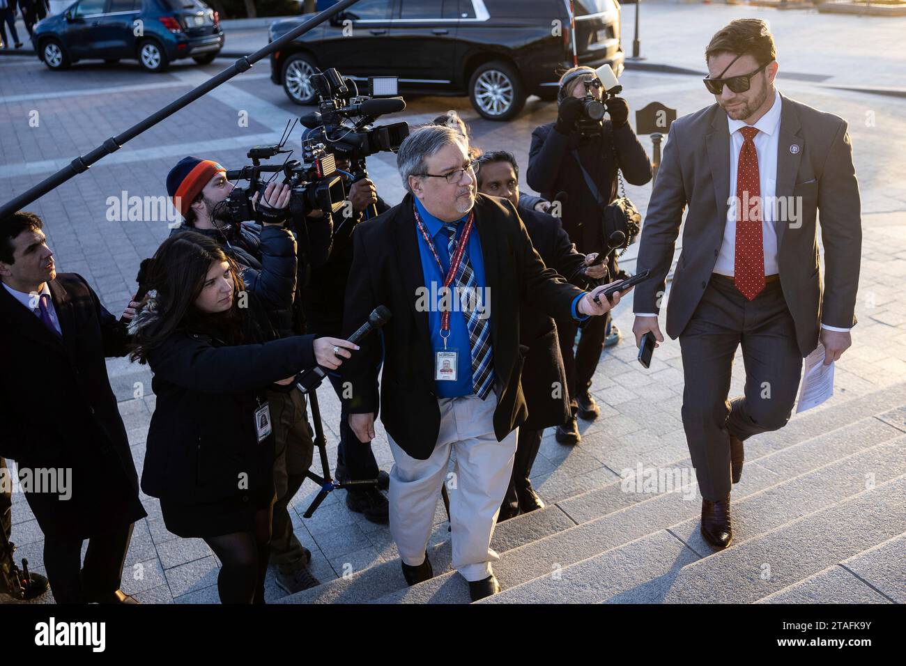 Rep. Dan Crenshaw (R-Texas) speaks with reporters as he arrives for a ...
