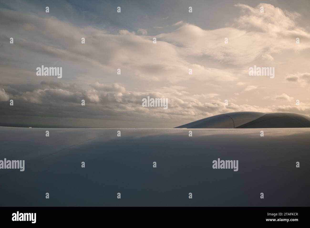 Beautiful clear deep blue sky over thick layer of clouds at ...