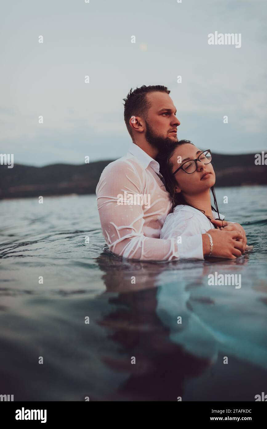 A symbolic and emotionally connected couple tenderly embraces against ...