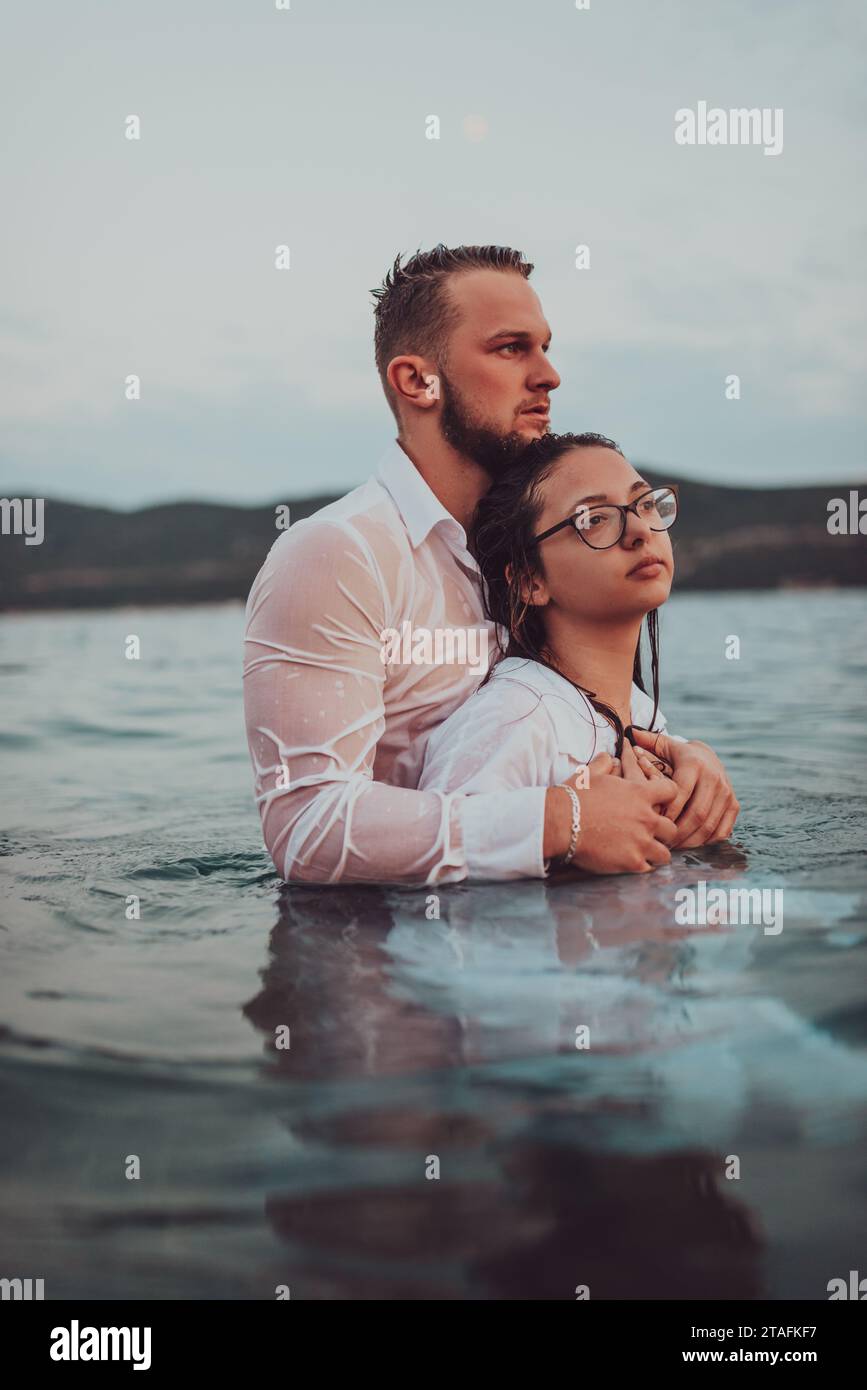A symbolic and emotionally connected couple tenderly embraces against ...
