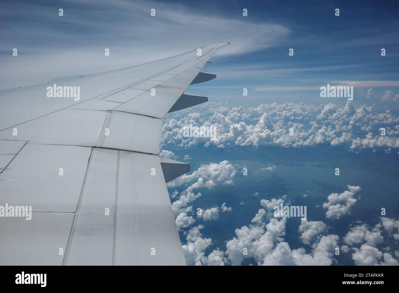Beautiful clear deep blue sky over thick layer of clouds at ...