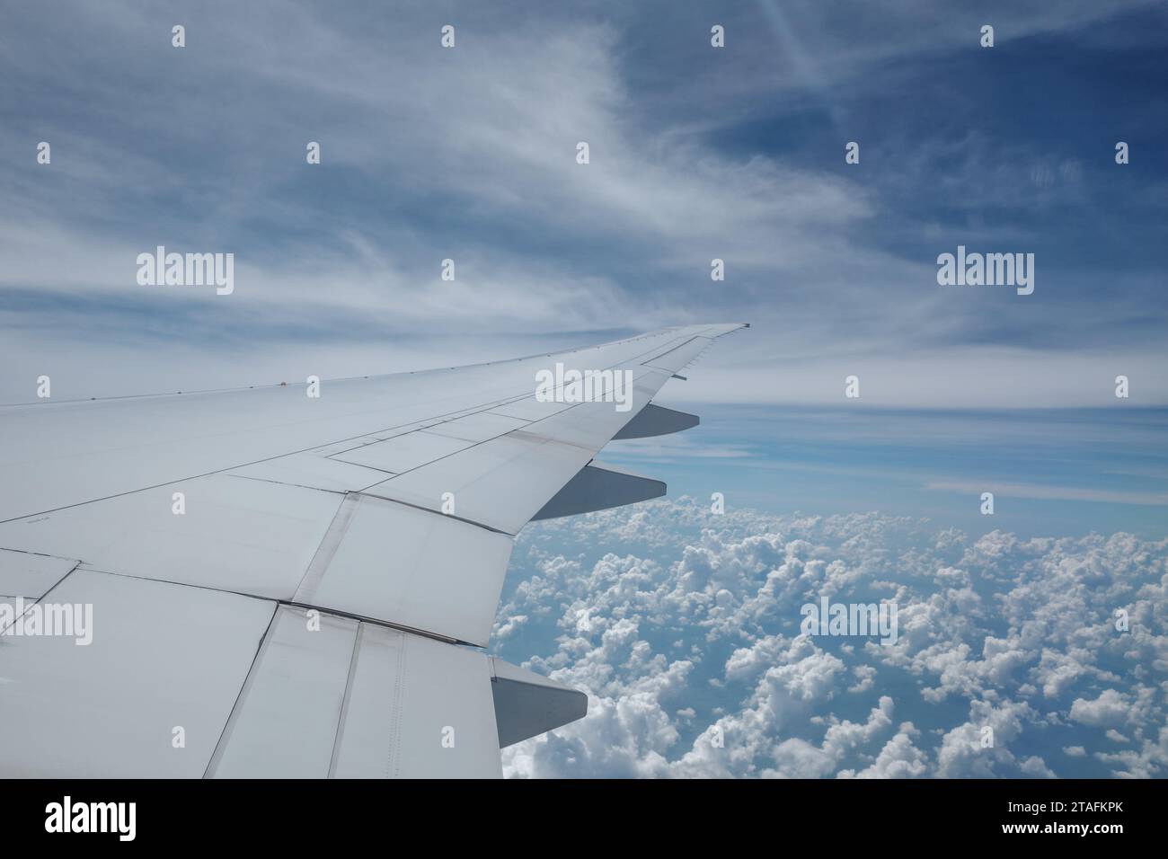 Beautiful clear deep blue sky over thick layer of clouds at ...