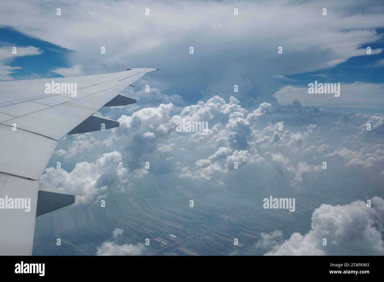 Beautiful clear deep blue sky over thick layer of clouds at ...