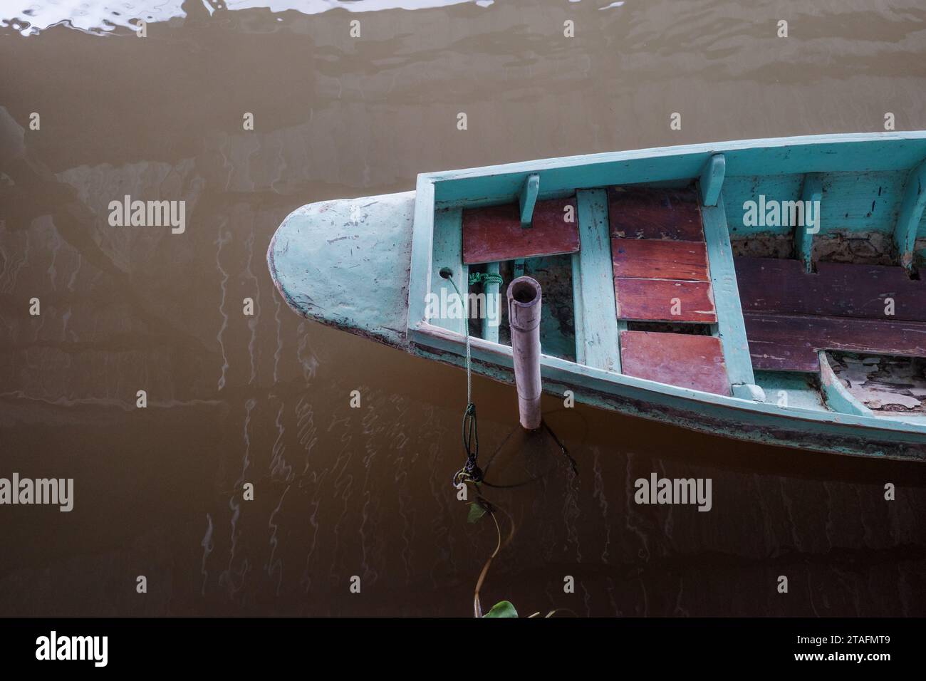 Top view small wooden boat docks on the canal beside wooden deck ...