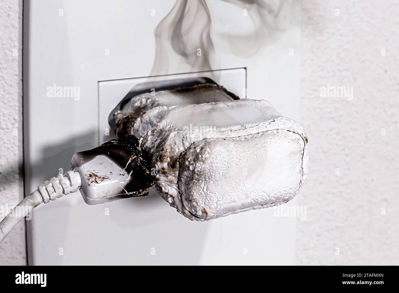 cell phone charger short-circuited, smoke and fire, electrical ...