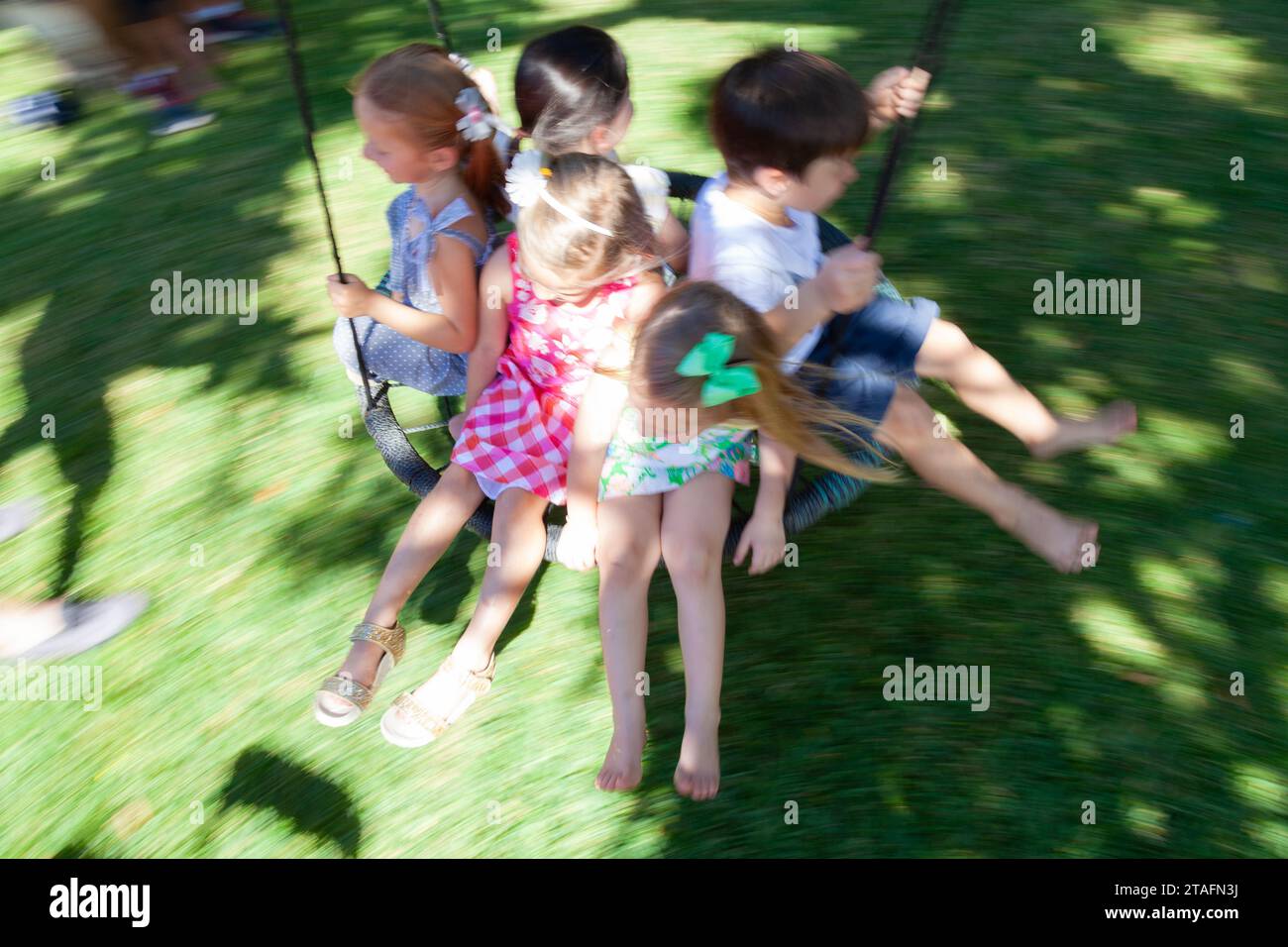 Group kids playing laughing hi-res stock photography and images - Alamy