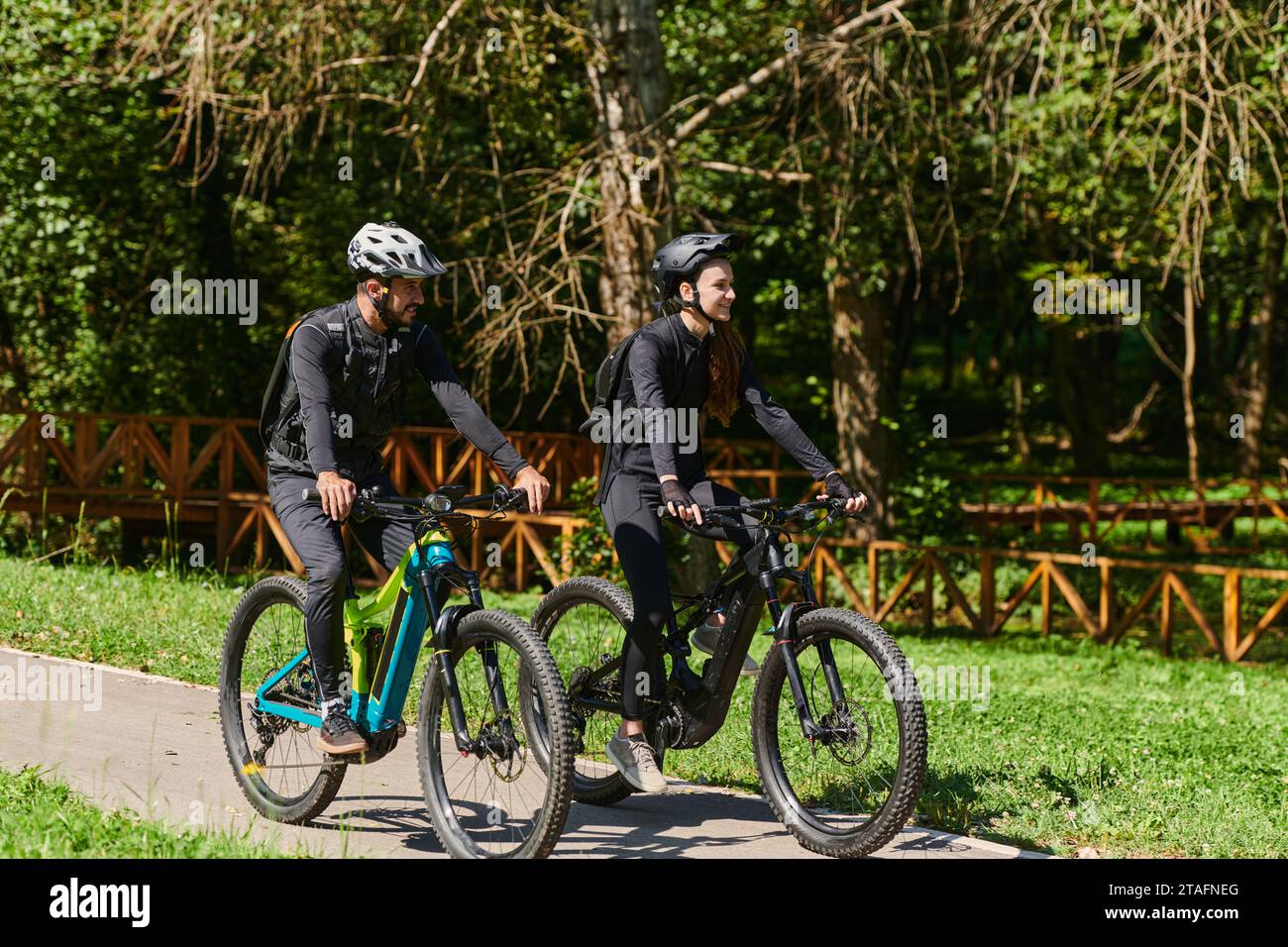 A blissful couple, adorned in professional cycling gear, enjoys a ...