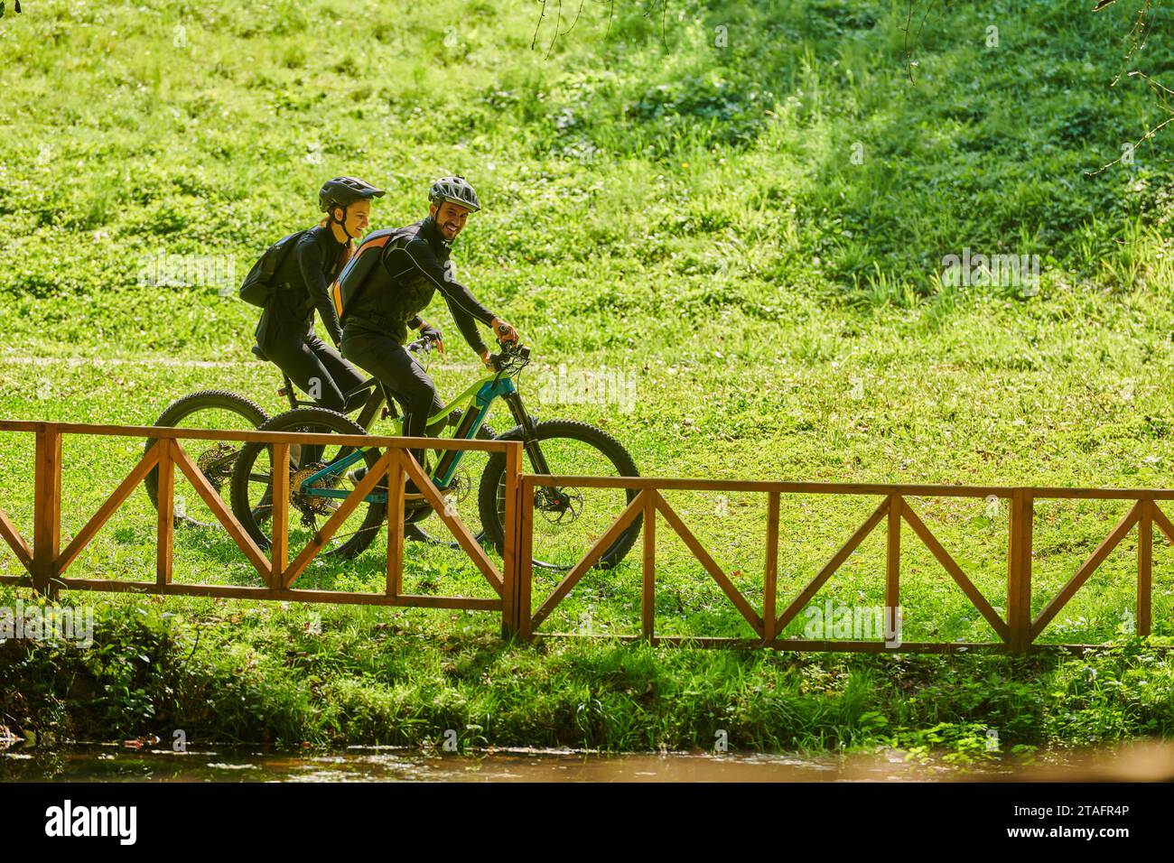A blissful couple, adorned in professional cycling gear, enjoys a ...