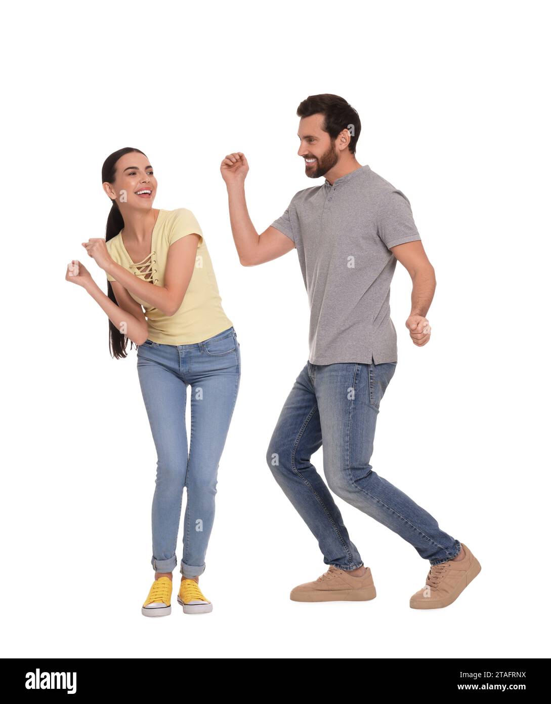 Happy couple dancing together on white background Stock Photo - Alamy