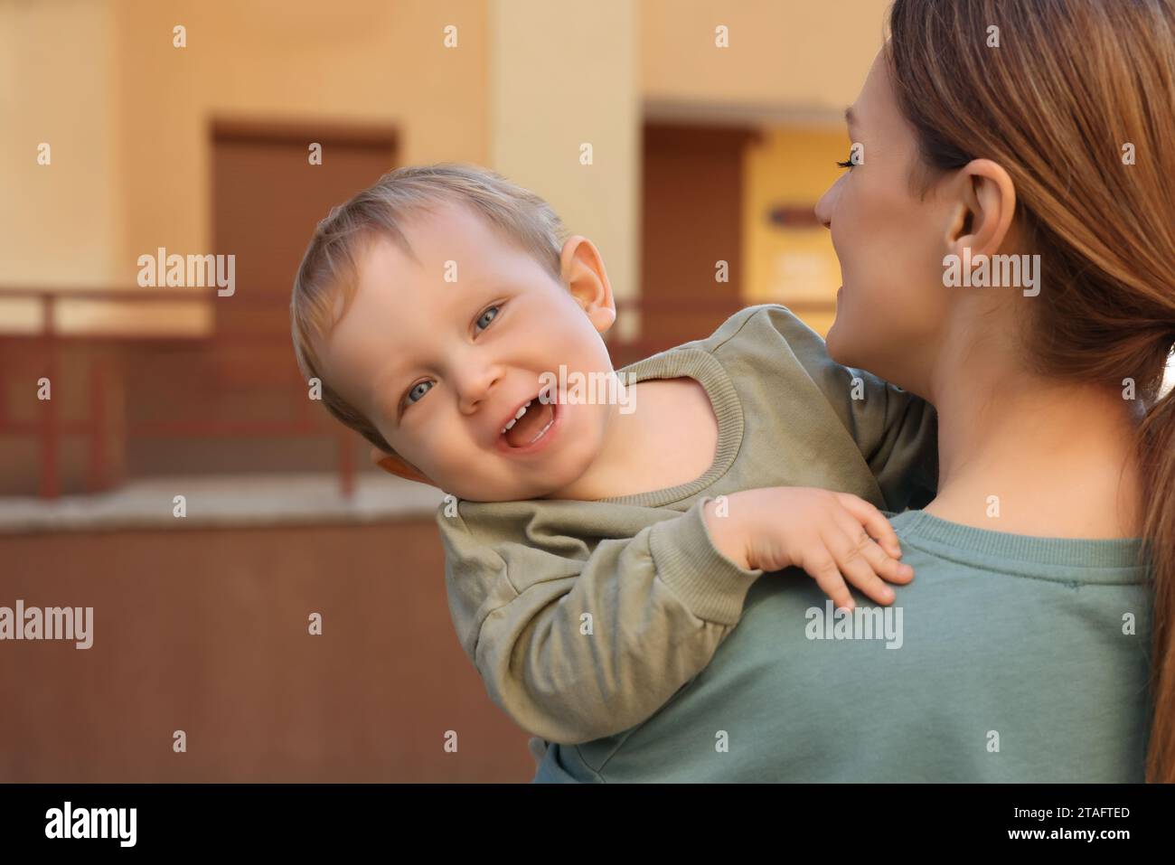 Portrait of nanny with cute little boy outdoors Stock Photo - Alamy