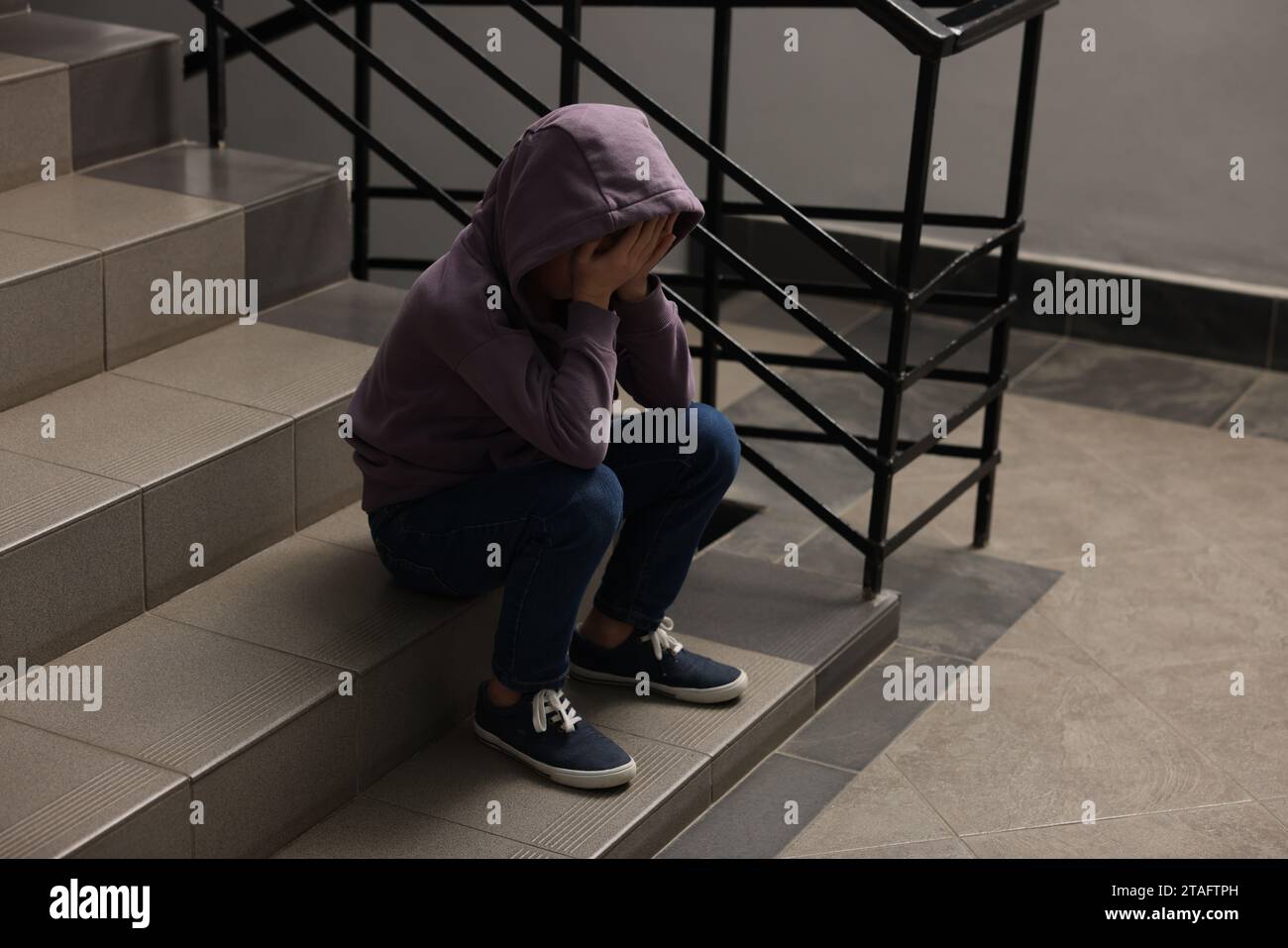 Boy child crying stairs alone hi-res stock photography and images - Alamy