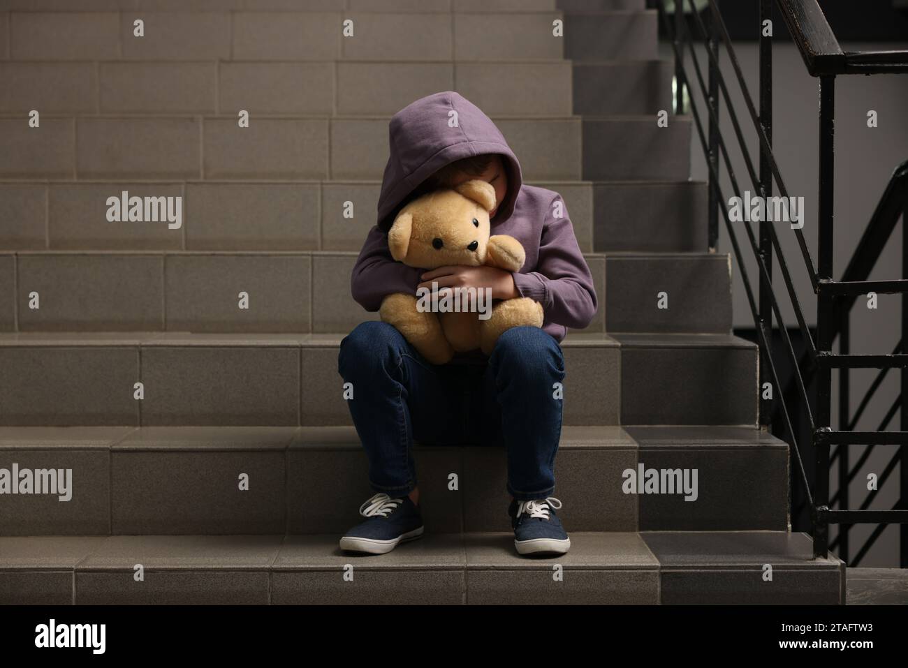 Boy child crying stairs alone hi-res stock photography and images - Alamy
