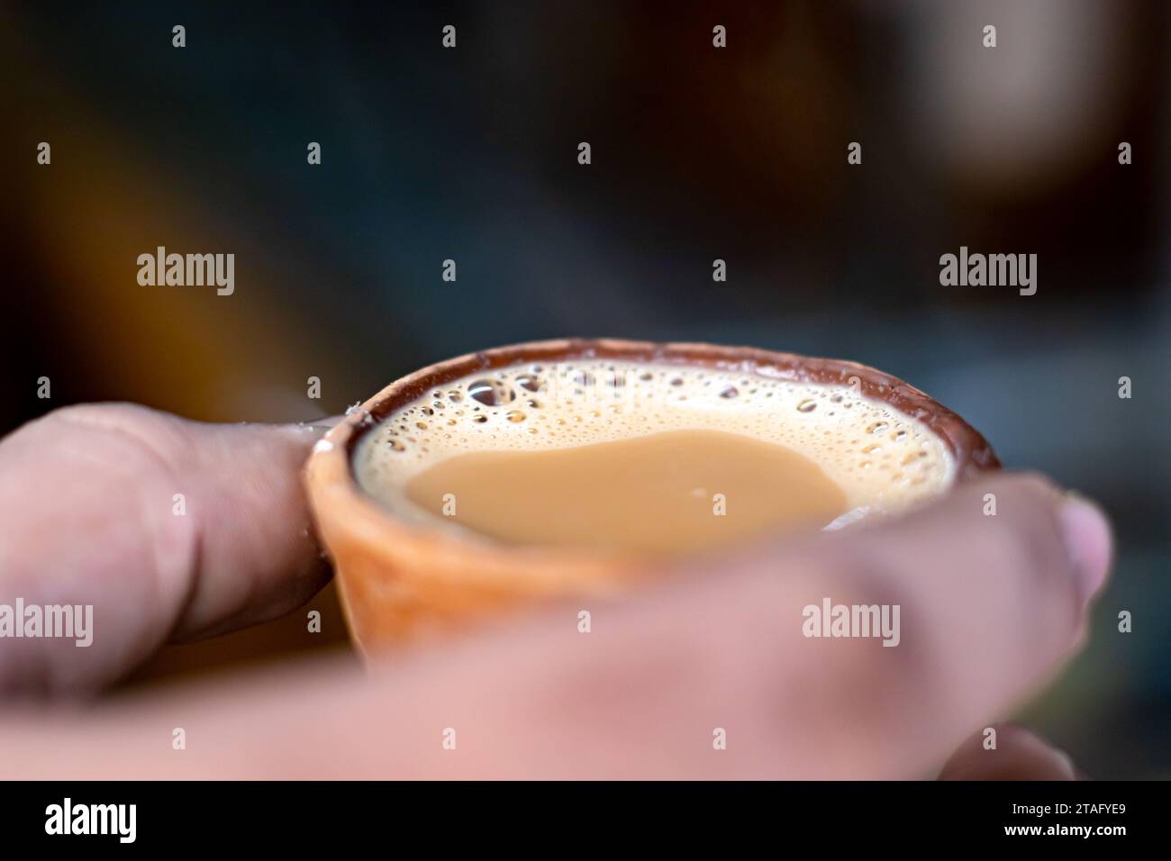 Hot milk tea or chai in traditional kulhad or clay pot or earthen cup ...