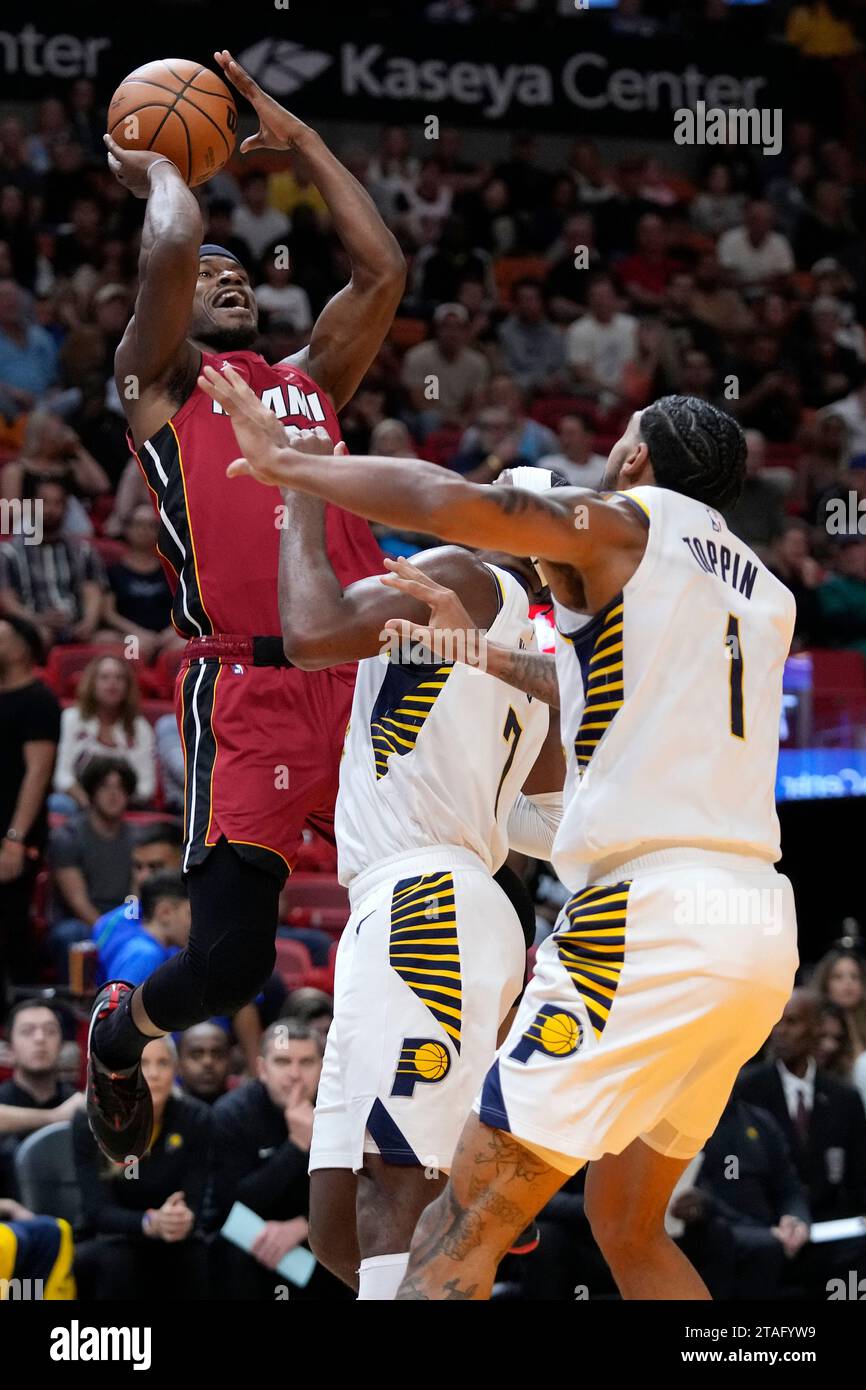 Miami Heat forward Jimmy Butler (22) goes up for a shot against Indiana ...