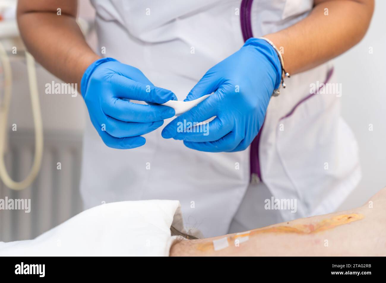 hand of Doctor is using clean cotton dressing infection wound at a man ...