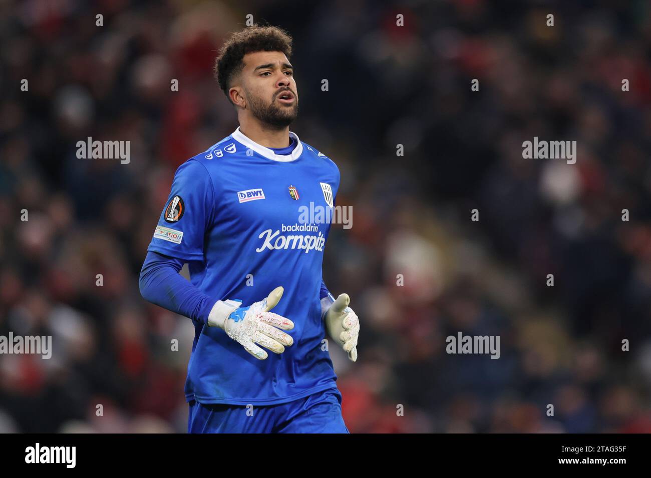 Liverpool, UK. 30th Nov, 2023. Tobias Lawal of LASK trying to keep warm ...