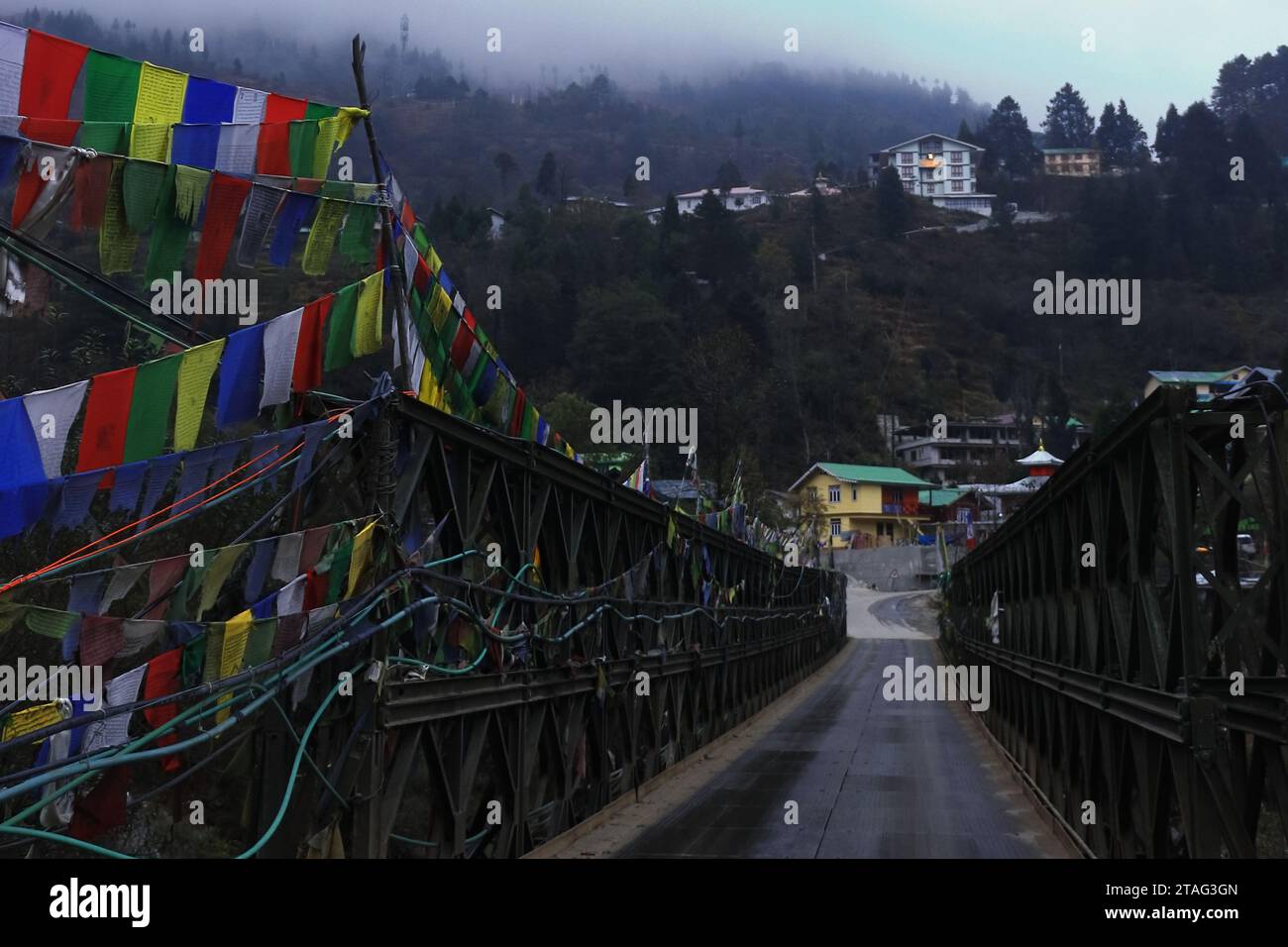 bridge over lachung chu river with buddhist prayer flags, beautiful ...