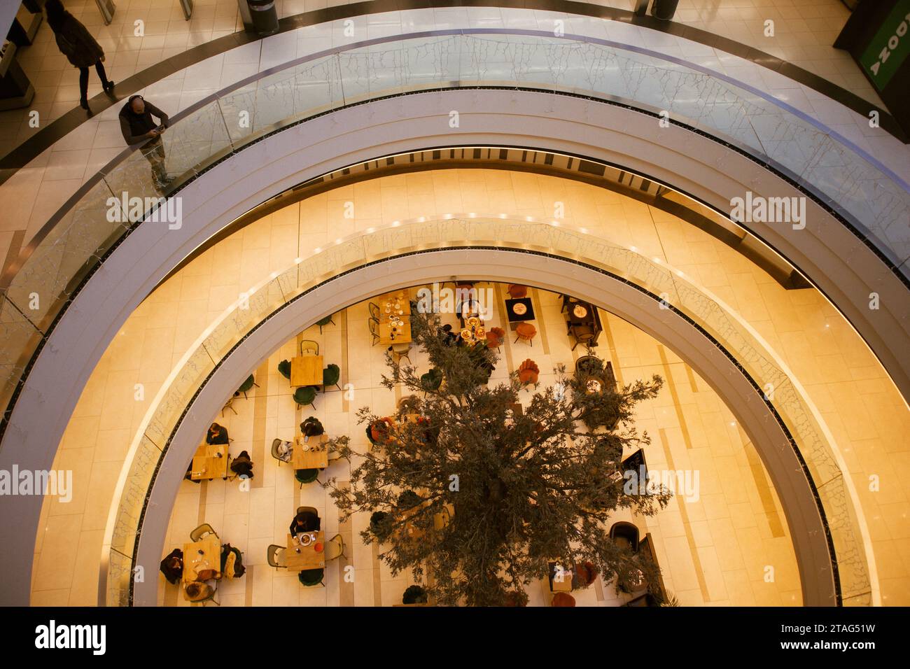 People sitting eating in food court, cafe, restaurant in shopping mall ...