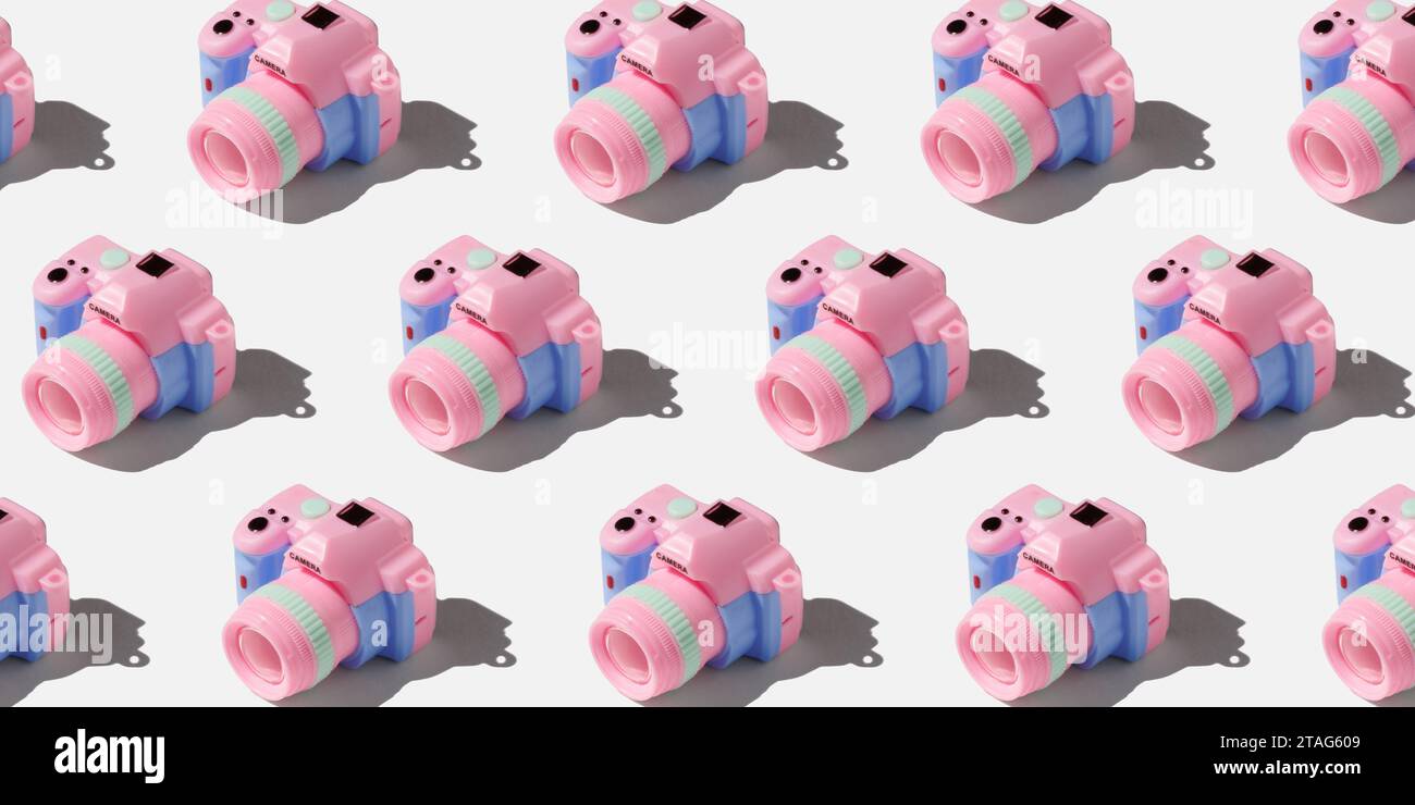 Pattern with camera on pastel color background Stock Photo - Alamy