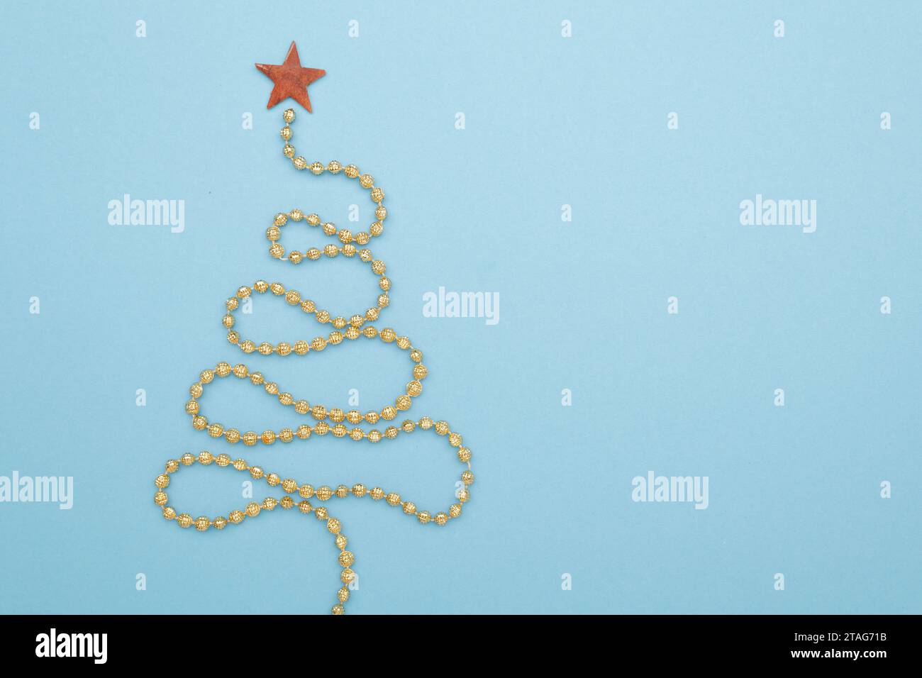 Christmas tree yellow garland on color background, flat lay Stock Photo ...
