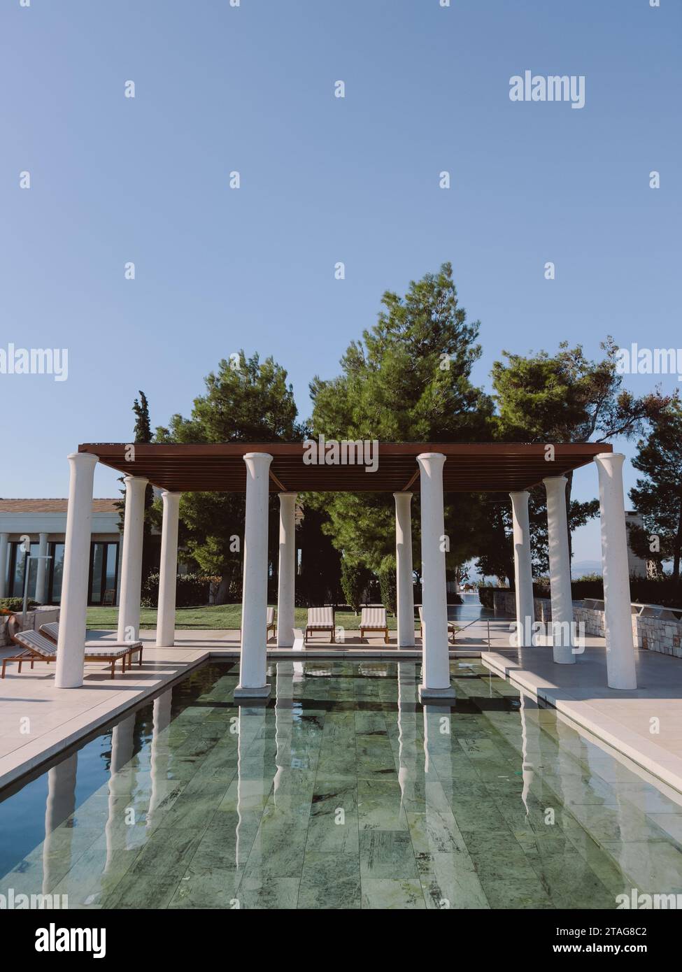 Pergola with columns near the pool. Hotel Amanzoe, Greece Stock Photo ...