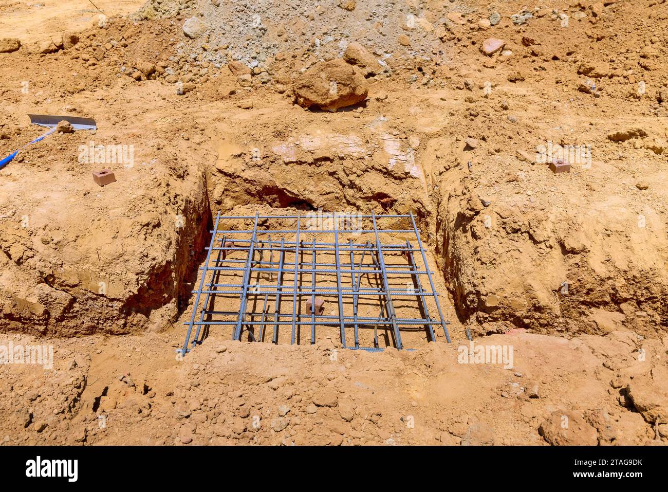Pouring concrete foundation in trench prepared for cottage concrete ...