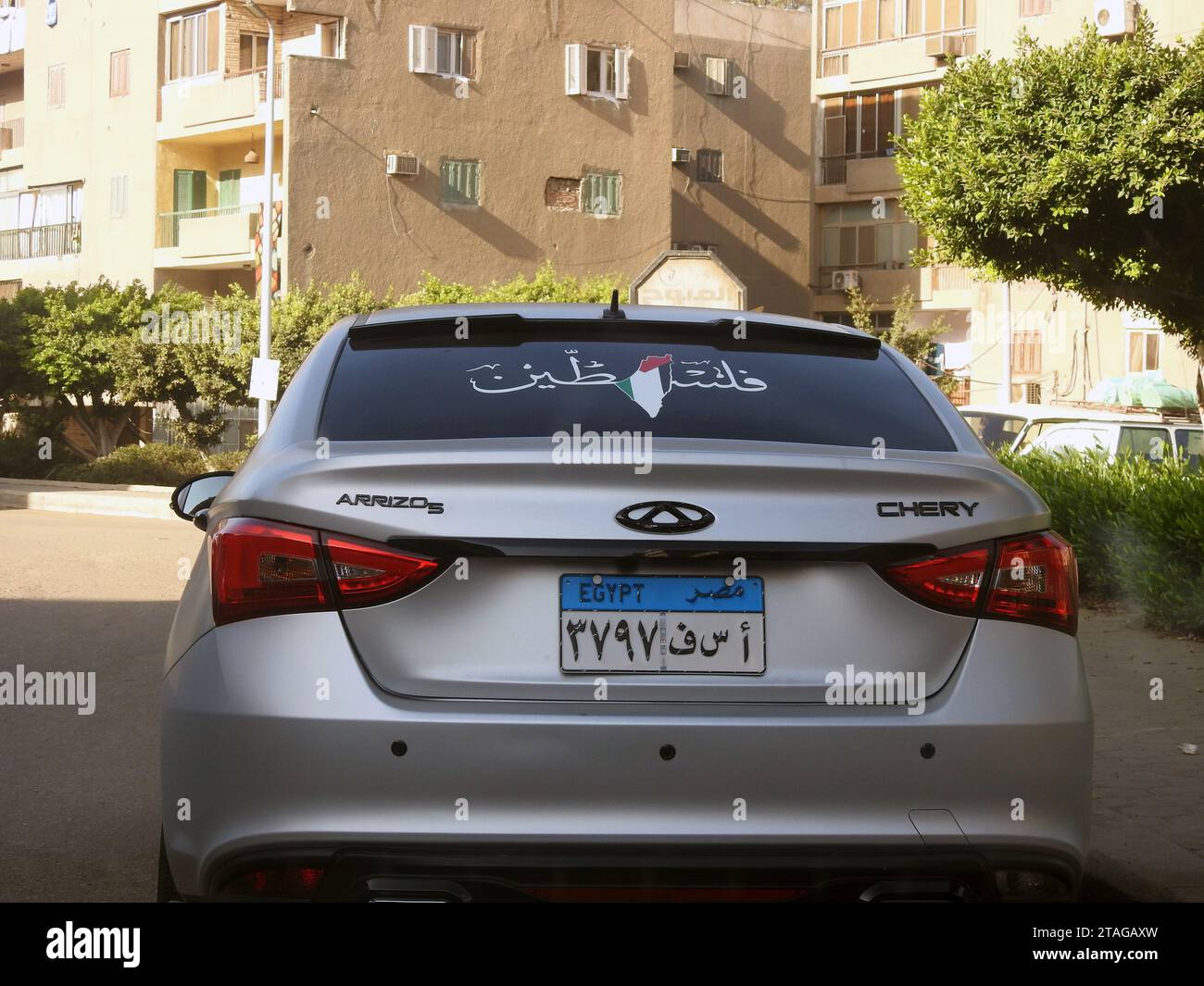 Cairo, Egypt, November 14 2023: Arabic word of Palestine on the back windshield of Chery car ...