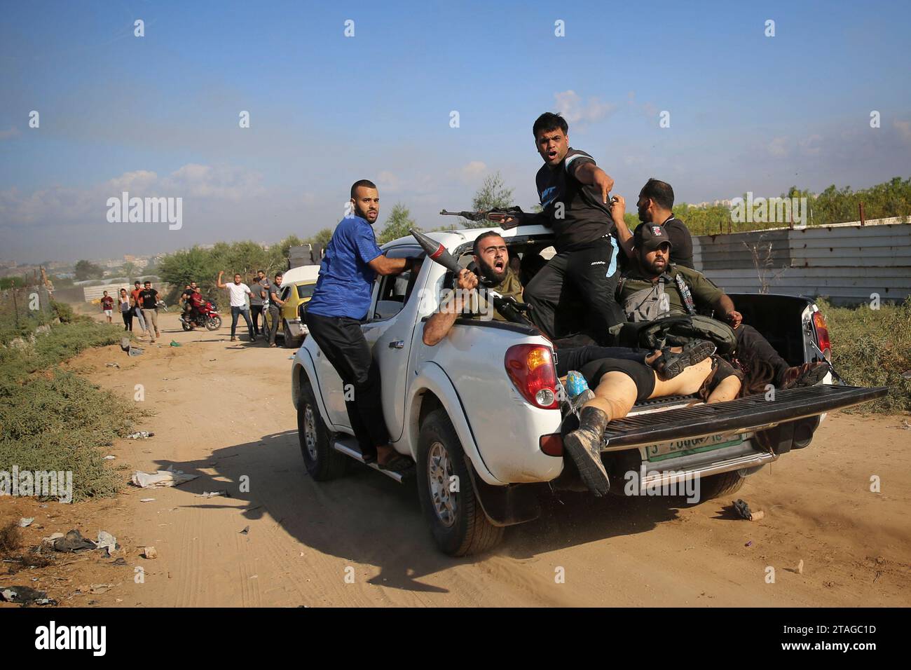 Palestinian militants drive back to the Gaza Strip with the body of ...