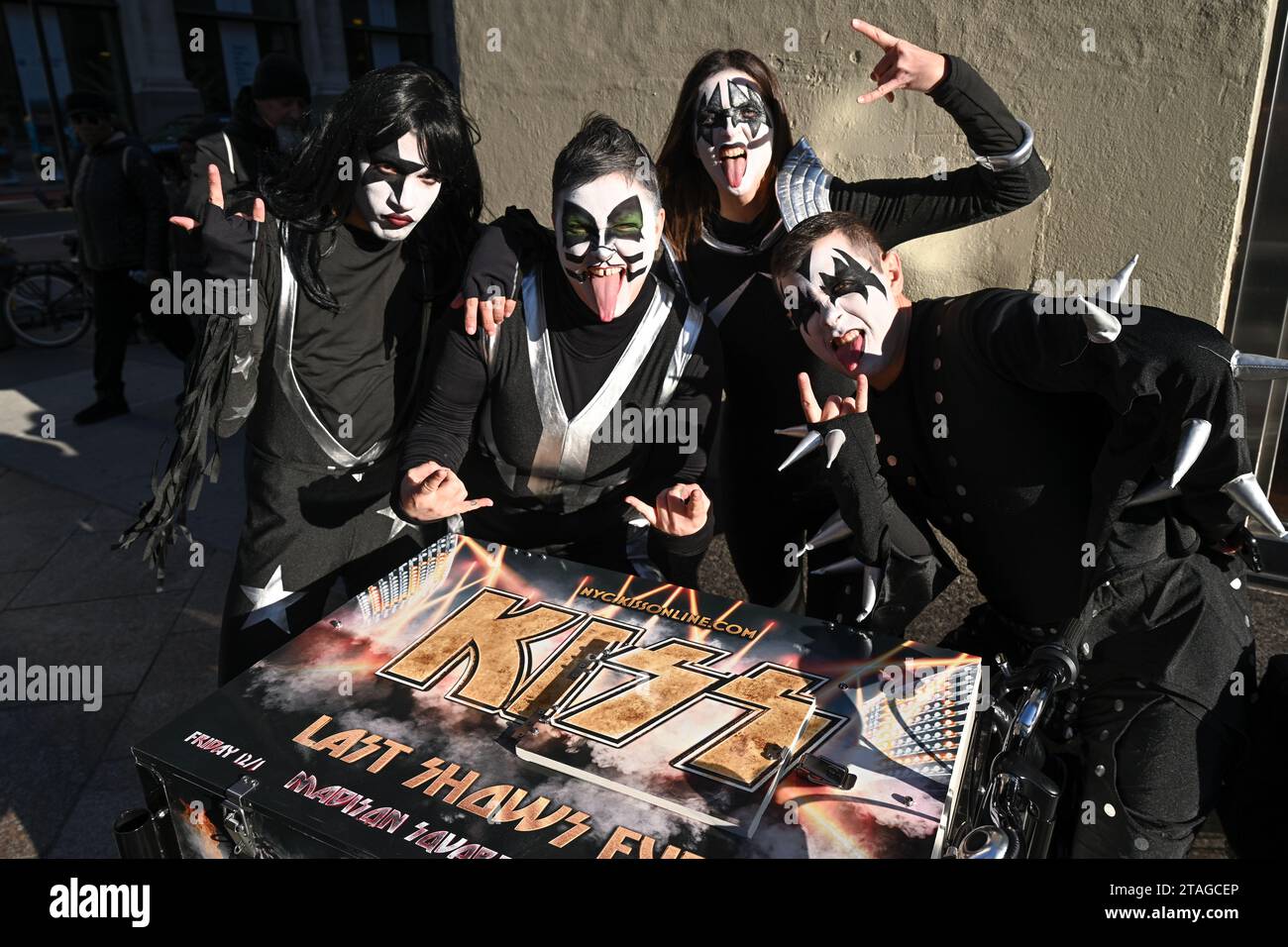 People dress in Kiss costumes outside the Empire State Building in ...