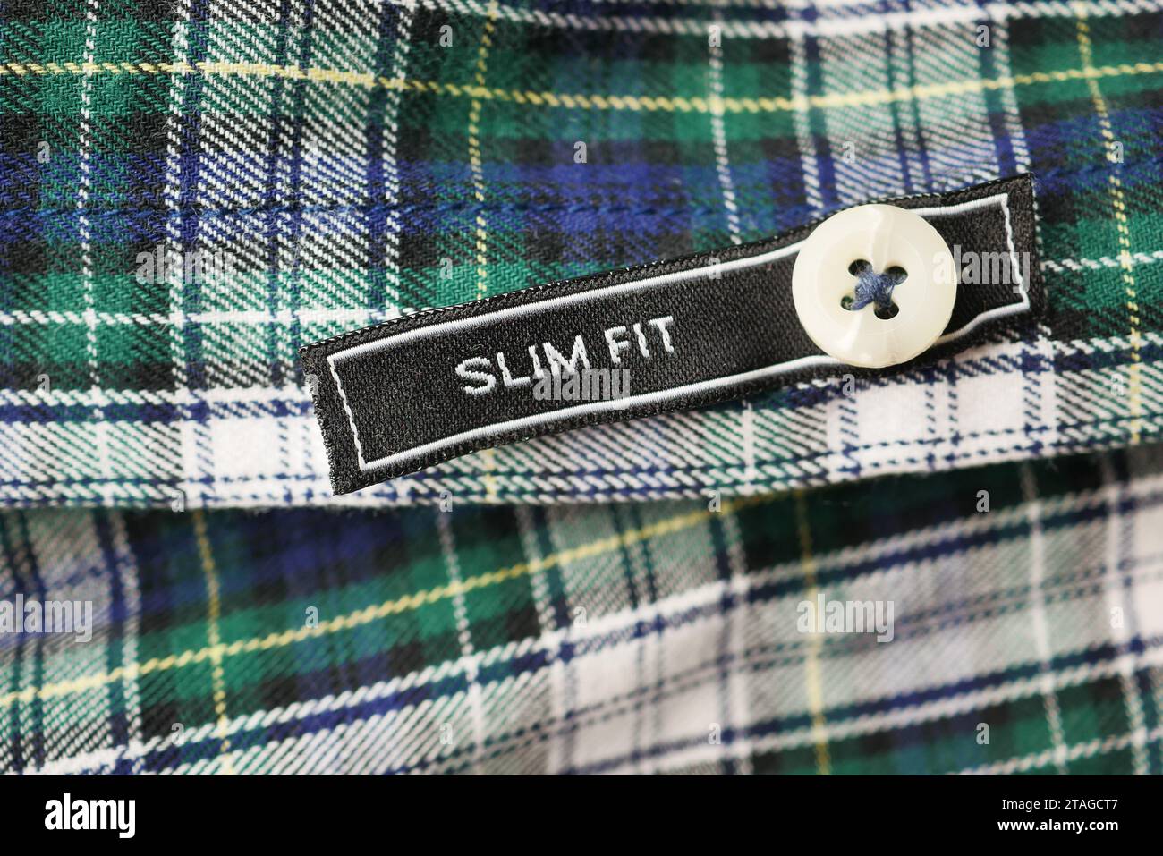 label tag slim fit on a men shirt Stock Photo - Alamy