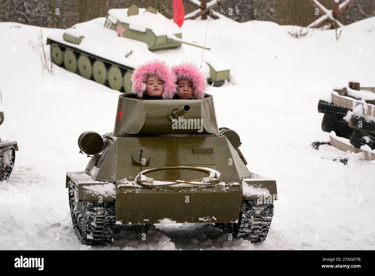Children ride a model of World War II-era Soviet tank during a military ...