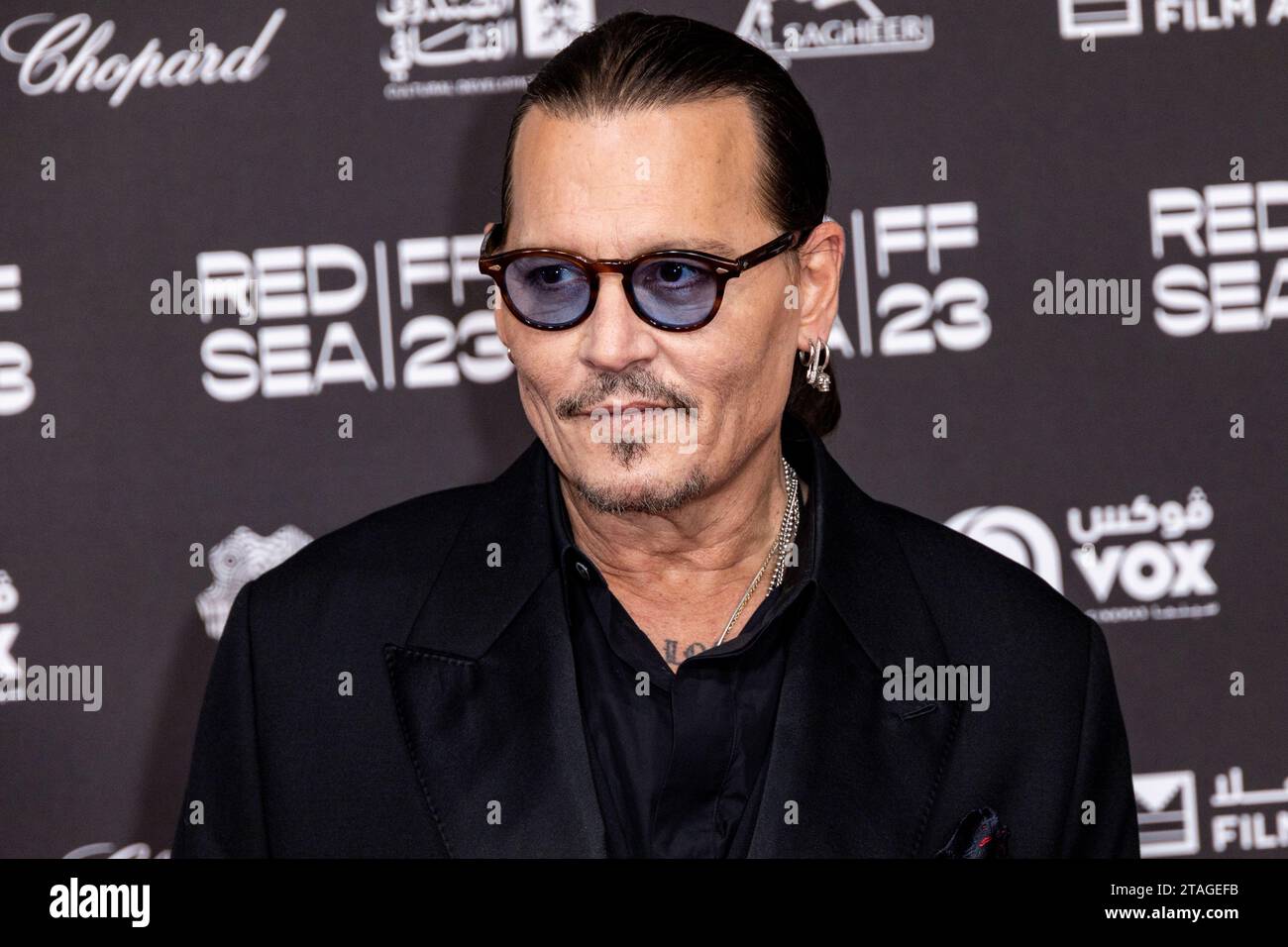 Johnny Depp poses for photographers upon arrival at the opening film ...