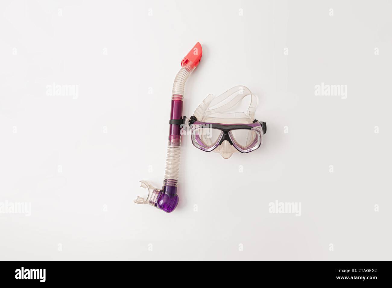 Purple plastic diving and snorkeling mask isolated on white background ...