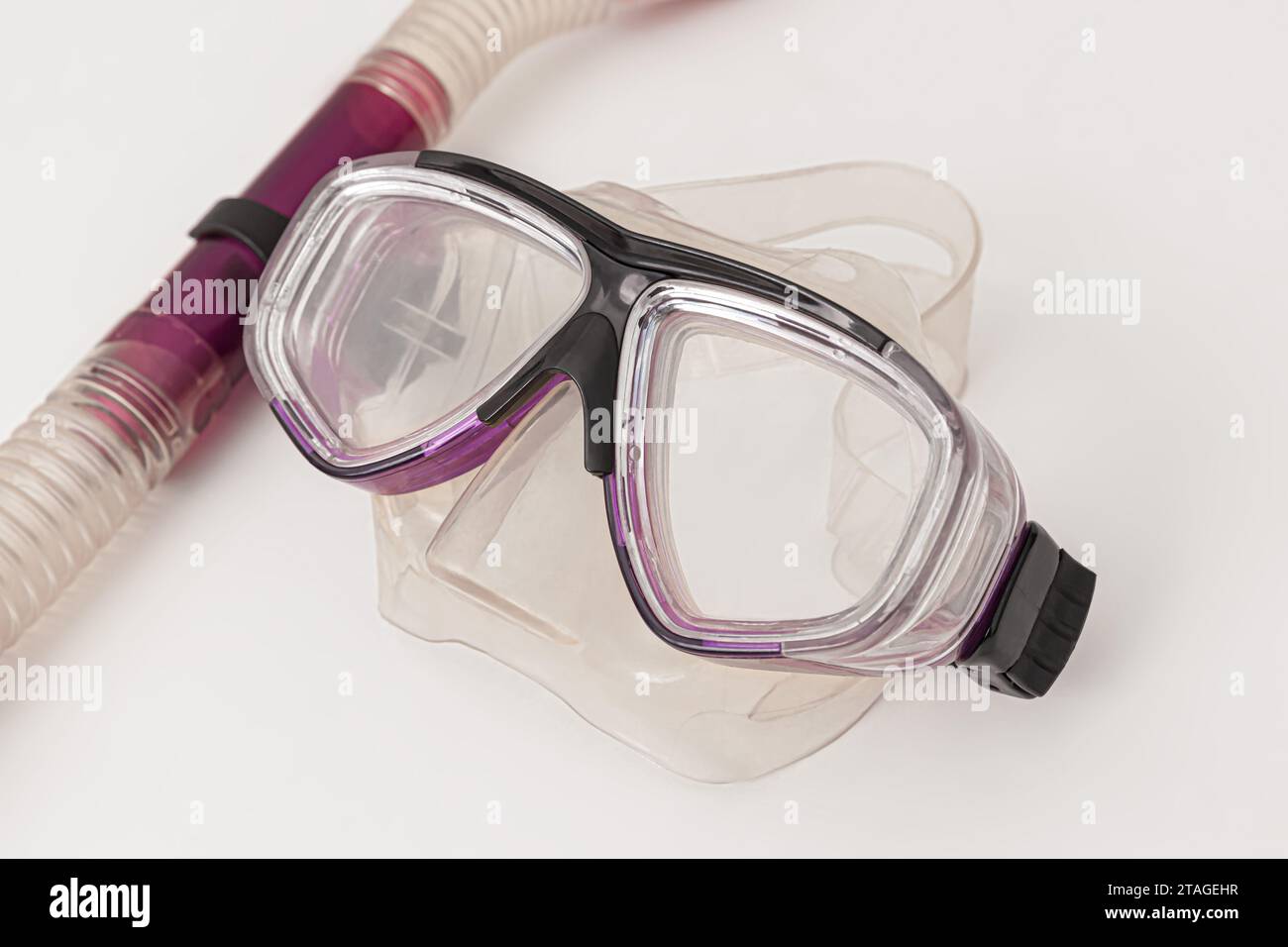 Purple plastic diving and snorkeling mask isolated on white background ...