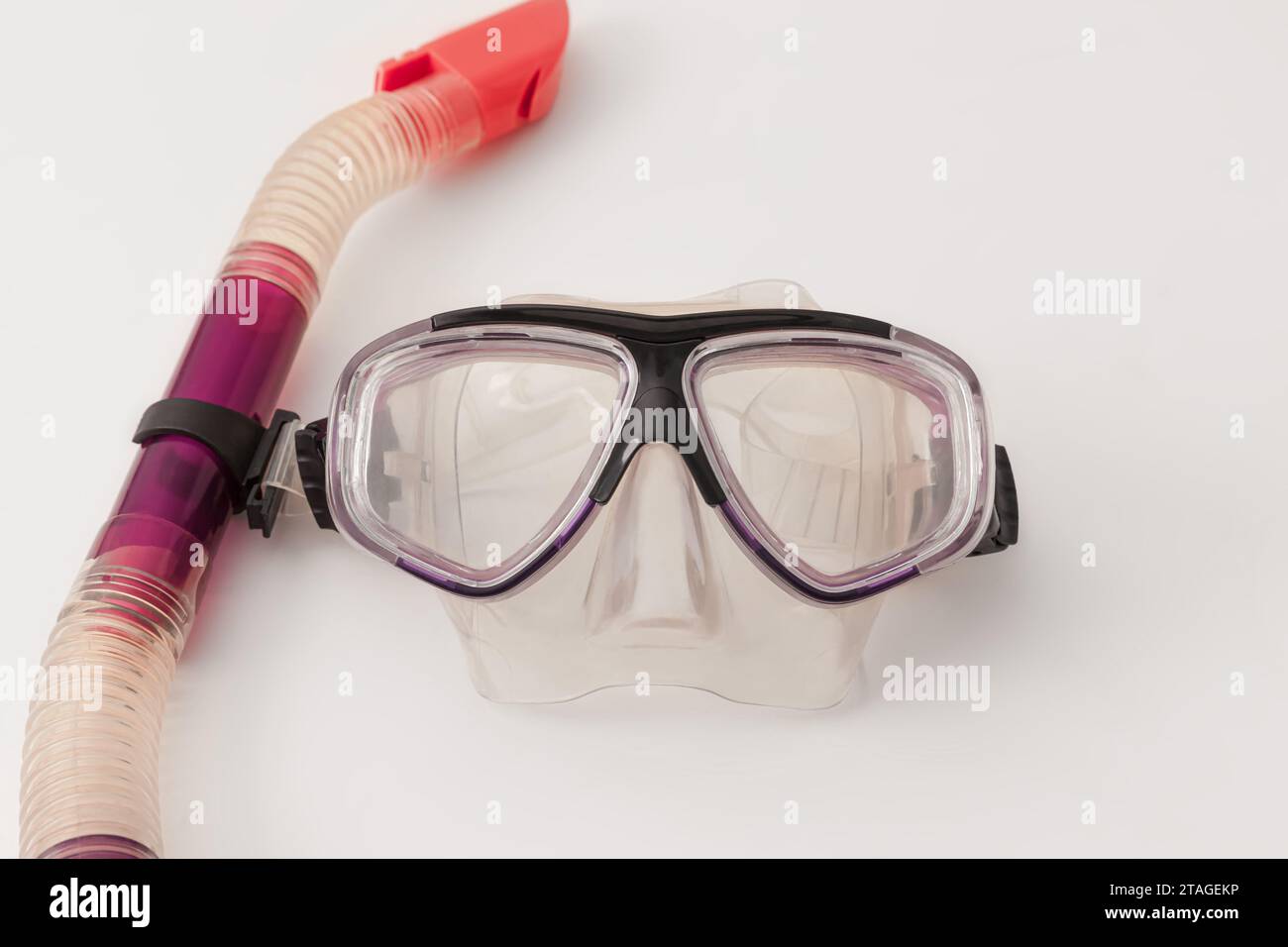 Purple plastic diving and snorkeling mask isolated on white background ...