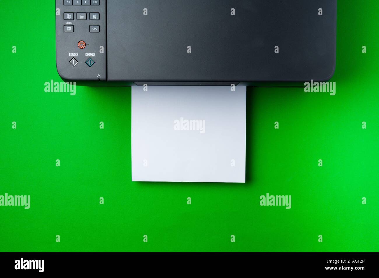 Modern printer with paper on green background Stock Photo - Alamy