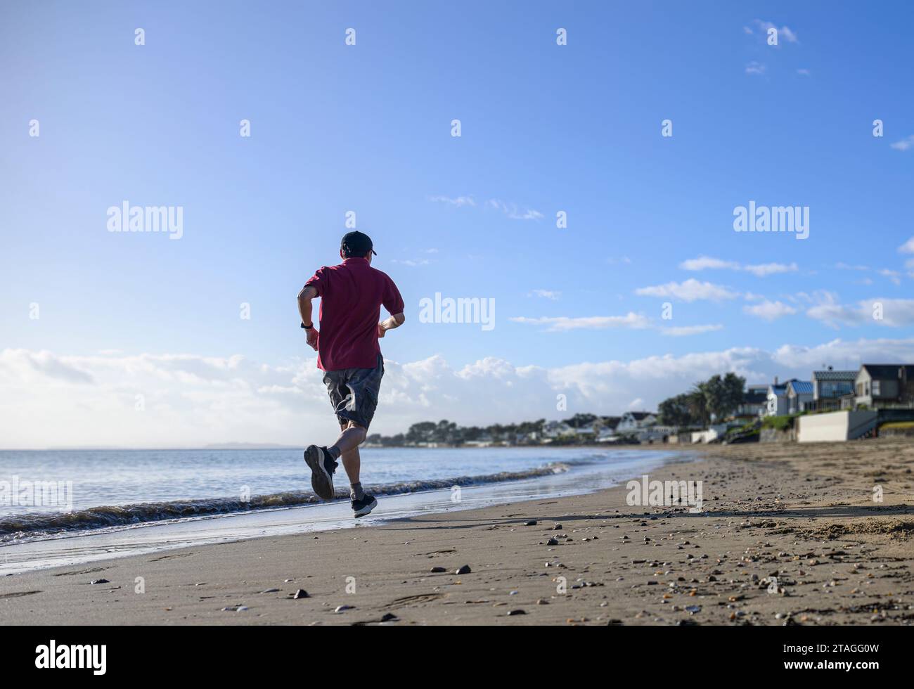 Man running in beach morning hi-res stock photography and images - Alamy