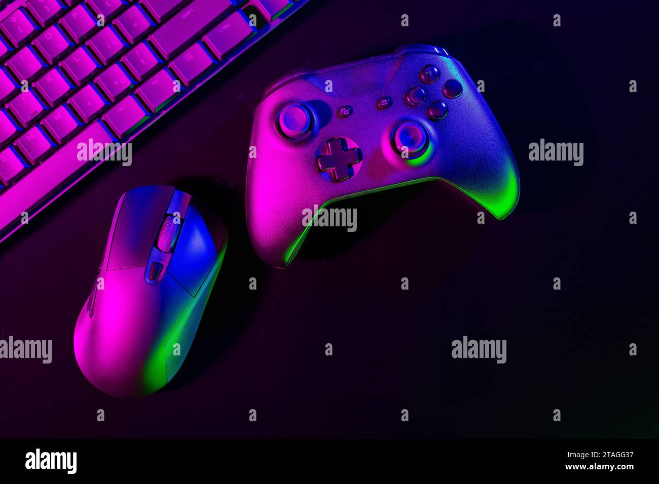 Computer keyboard, mouse and joystick on black background Stock Photo ...