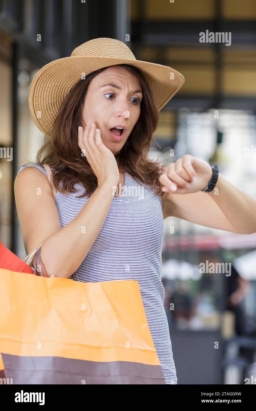 Caucasian girl looking wristwatch hi-res stock photography and images ...